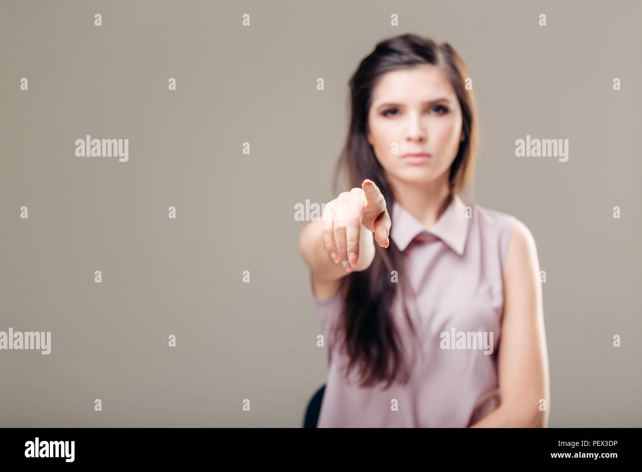 Woman pointing to the camera. focus on finger Stock Photo - Alamy