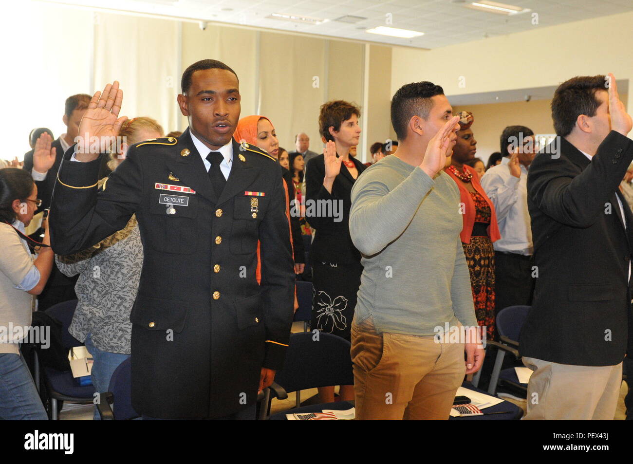Pvt. Mookerdjee Cetoute recites the American Oath of Citizenship during ...