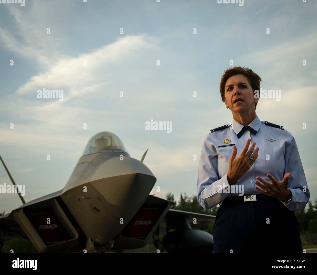 U.S. and Singapore Air Force personnel attend a briefing in front of an ...