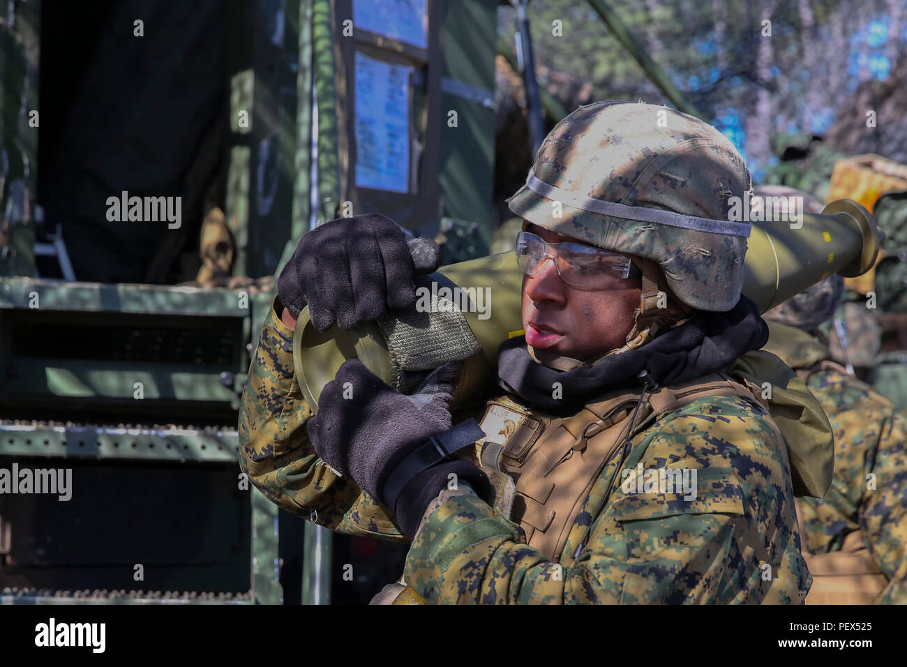 Lance Cpl. Christopher Lewis, a field artillery cannoneer with 1st ...