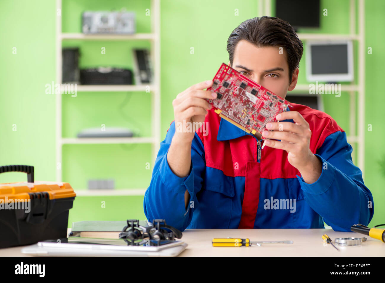 Computer engineer repairing broken desktop Stock Photo - Alamy
