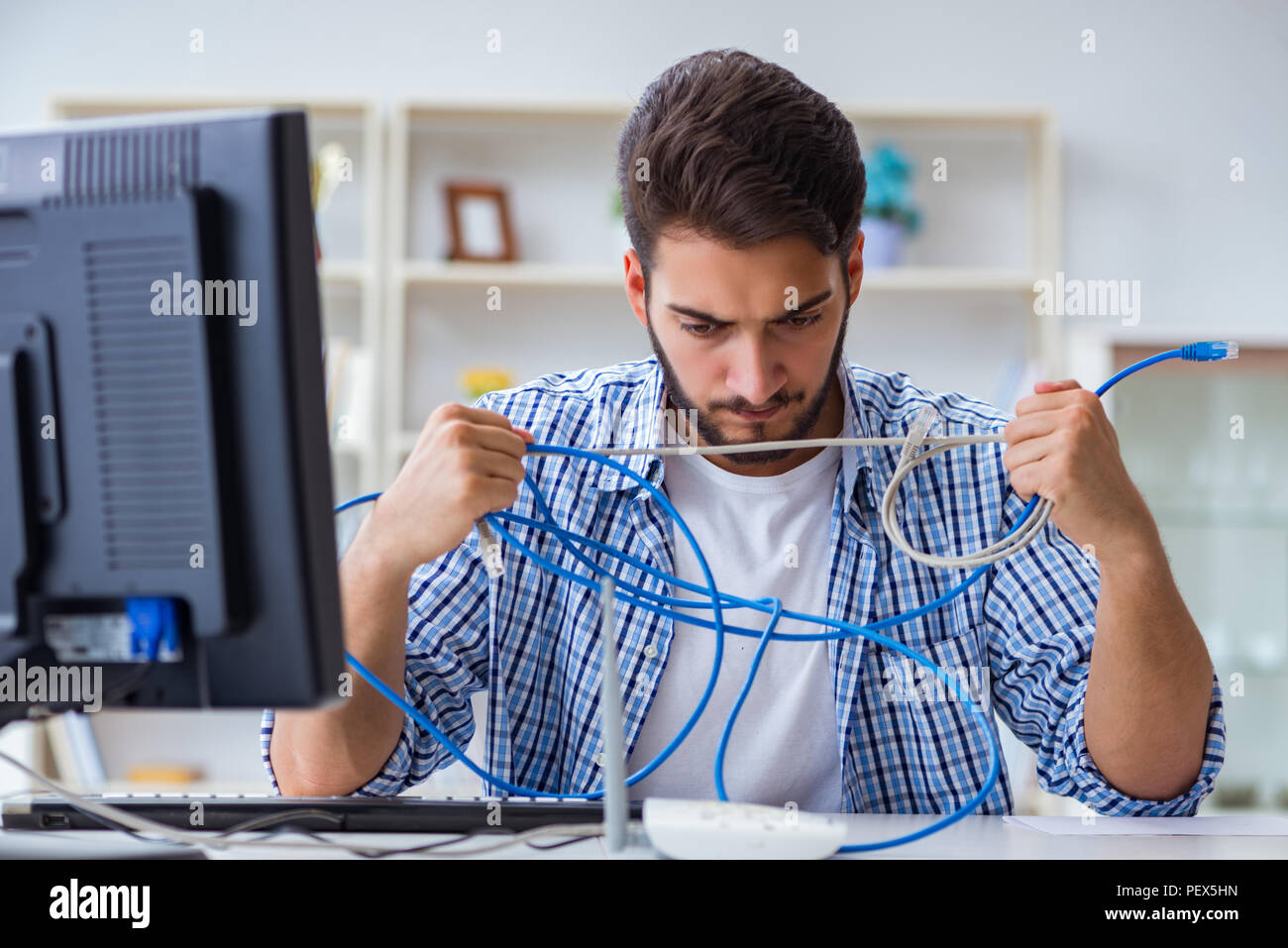 Frustrated young man due to weak internet reception Stock Photo - Alamy