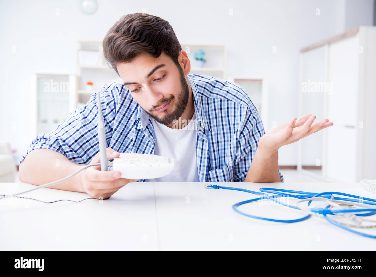 Frustrated young man due to weak internet reception Stock Photo - Alamy