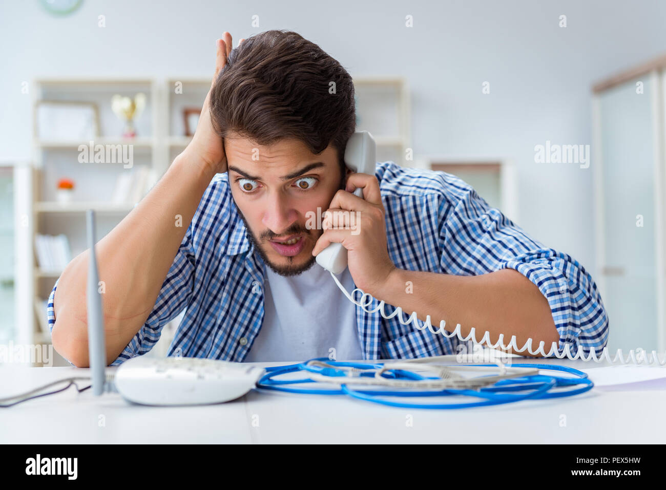Frustrated young man due to weak internet reception Stock Photo - Alamy
