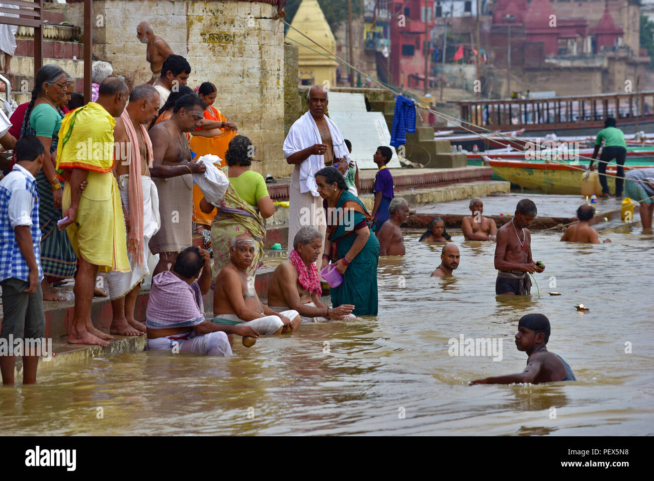 Hindu Indian pilgrims bathing and praying in Ganges river Stock Photo ...