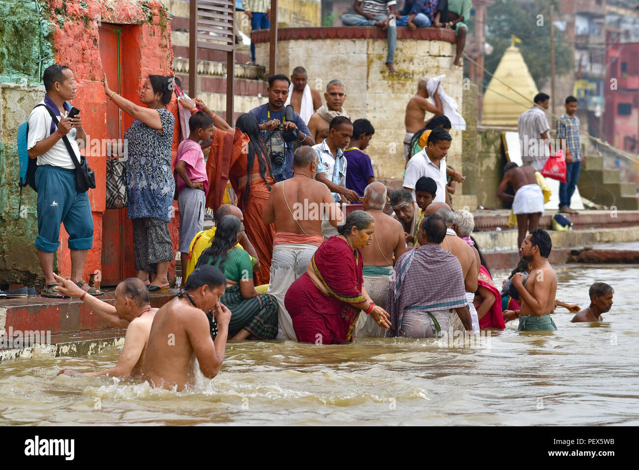 Hindu Indian pilgrims bathing and praying in Ganges river Stock Photo ...