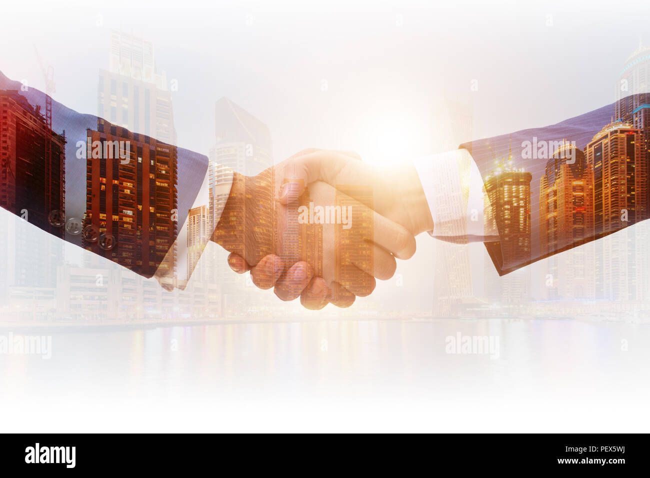 Concept of cooperation with handshake Stock Photo - Alamy