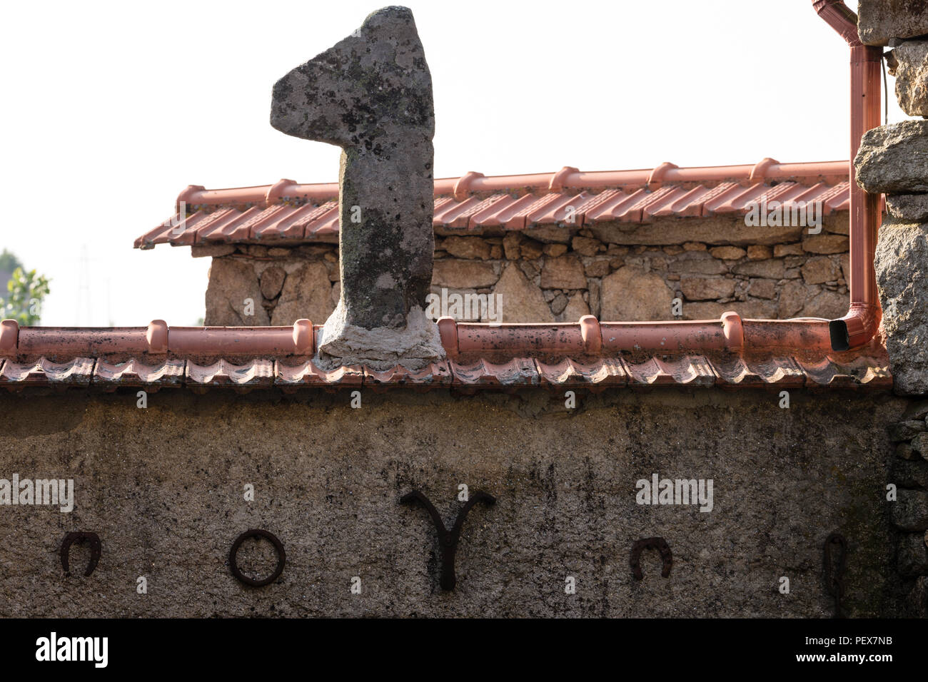 Traditional village scene with old blacksmith sign and horseshoe and ...