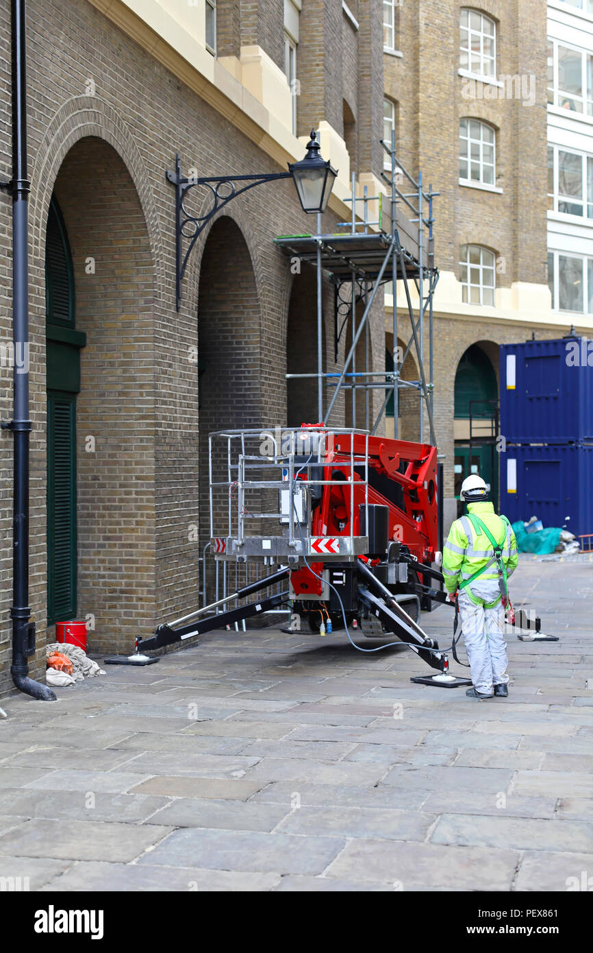 Aerial work platform at construction site Stock Photo - Alamy
