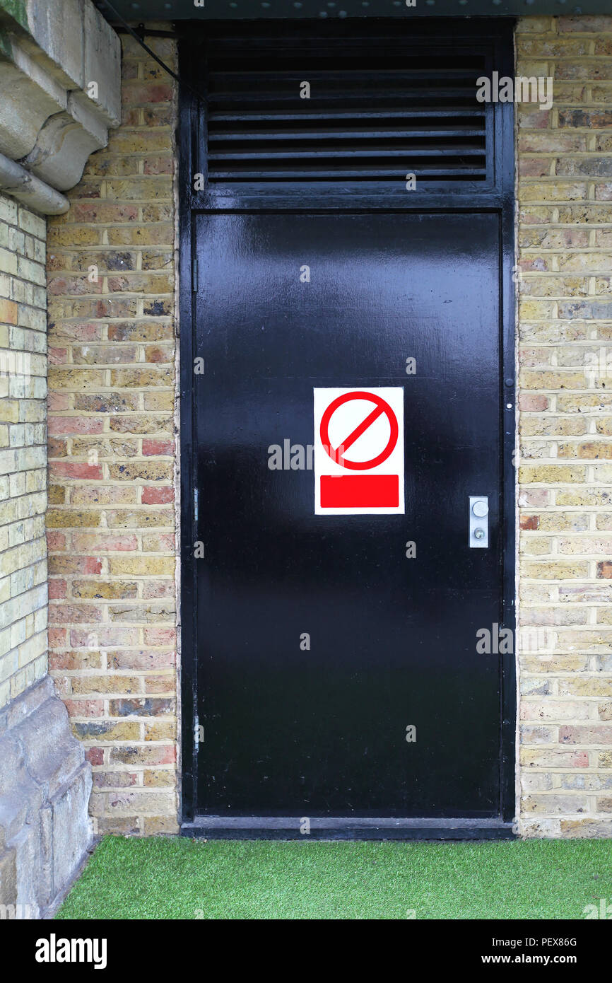 Black back door emergency exit and fire escape Stock Photo - Alamy