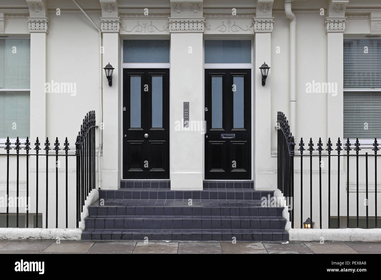 Two black doors at Victorian house in London Stock Photo - Alamy