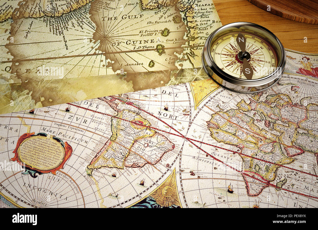 Vintage map and vintage compass with magnifying glass at the corner ...