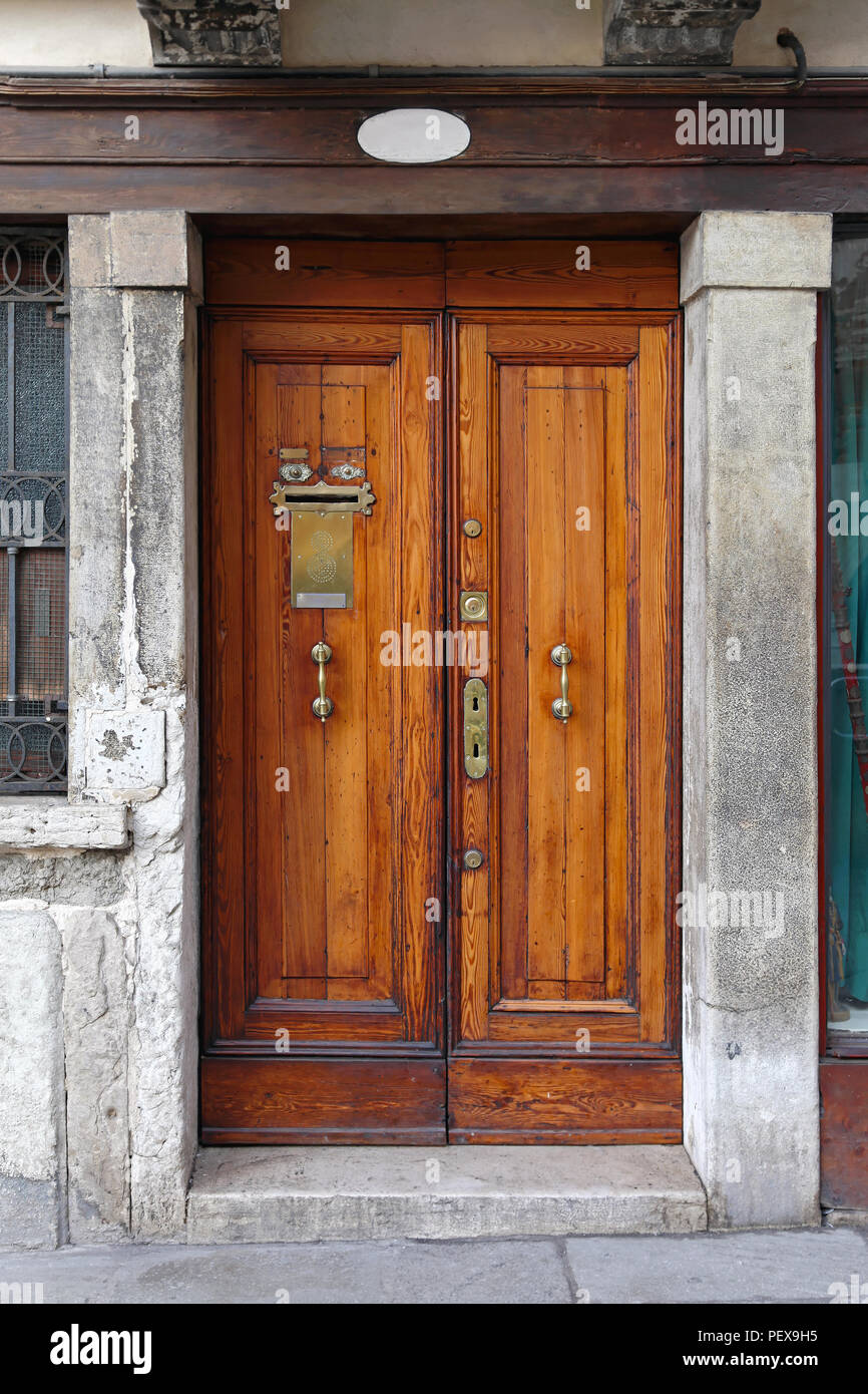 Traditional medieval wooden door in Venice Stock Photo - Alamy