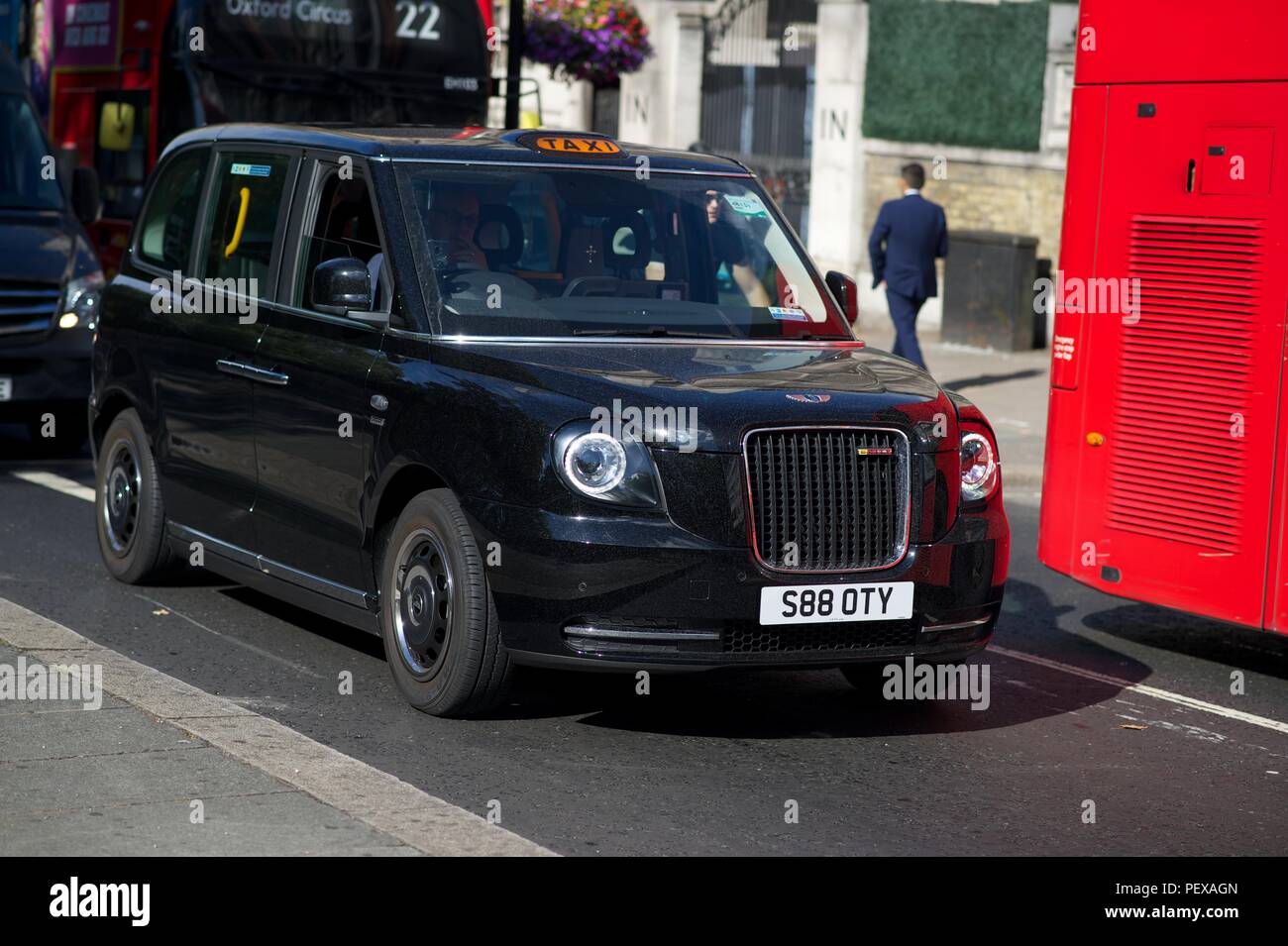 Fully electric black cab Stock Photo - Alamy
