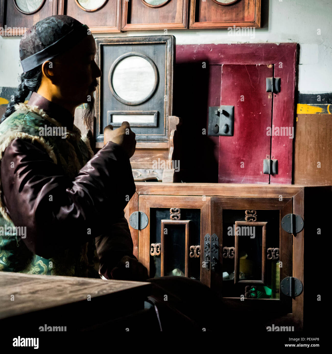 Asian Man Wax Sculpture and traditional interior design at Pingyao ...