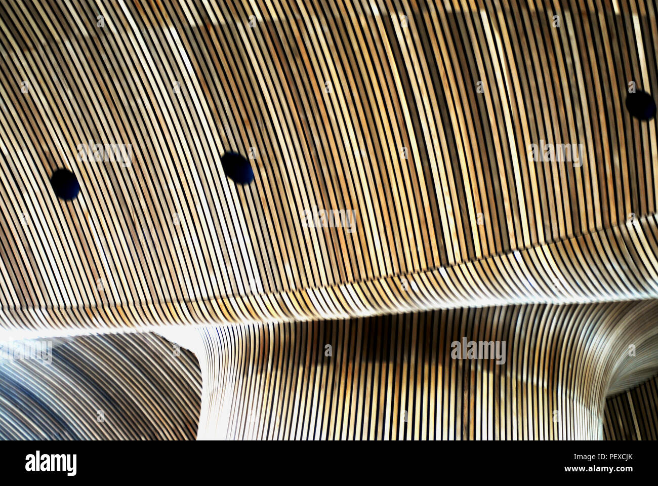 Abstract close up of a uniquely designed undulating wooden ceiling in ...