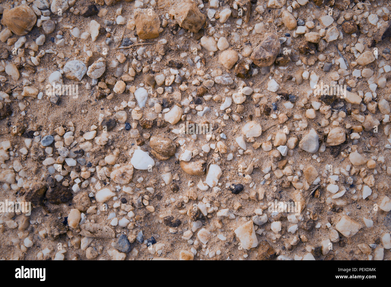 top view gravel pebbles and sand on background close up Stock Photo - Alamy