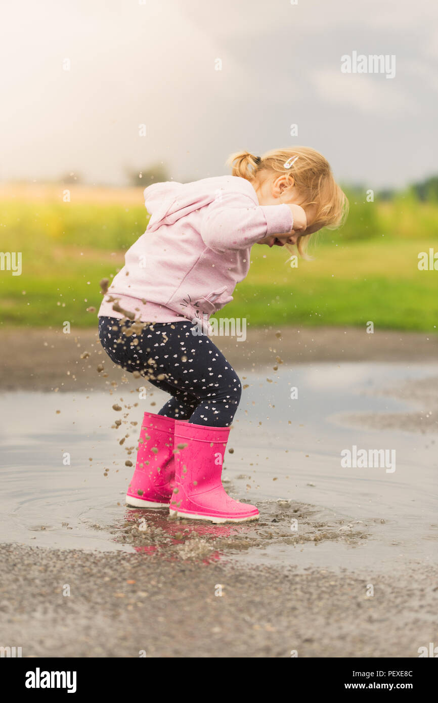 Baby in wellies hi-res stock photography and images - Alamy
