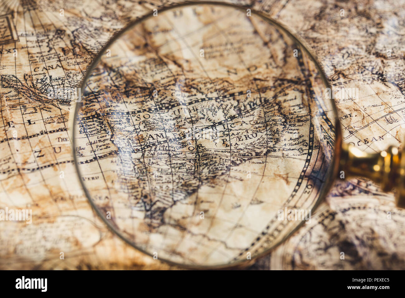 View through magnifier on old map, showing "America" word Stock Photo ...