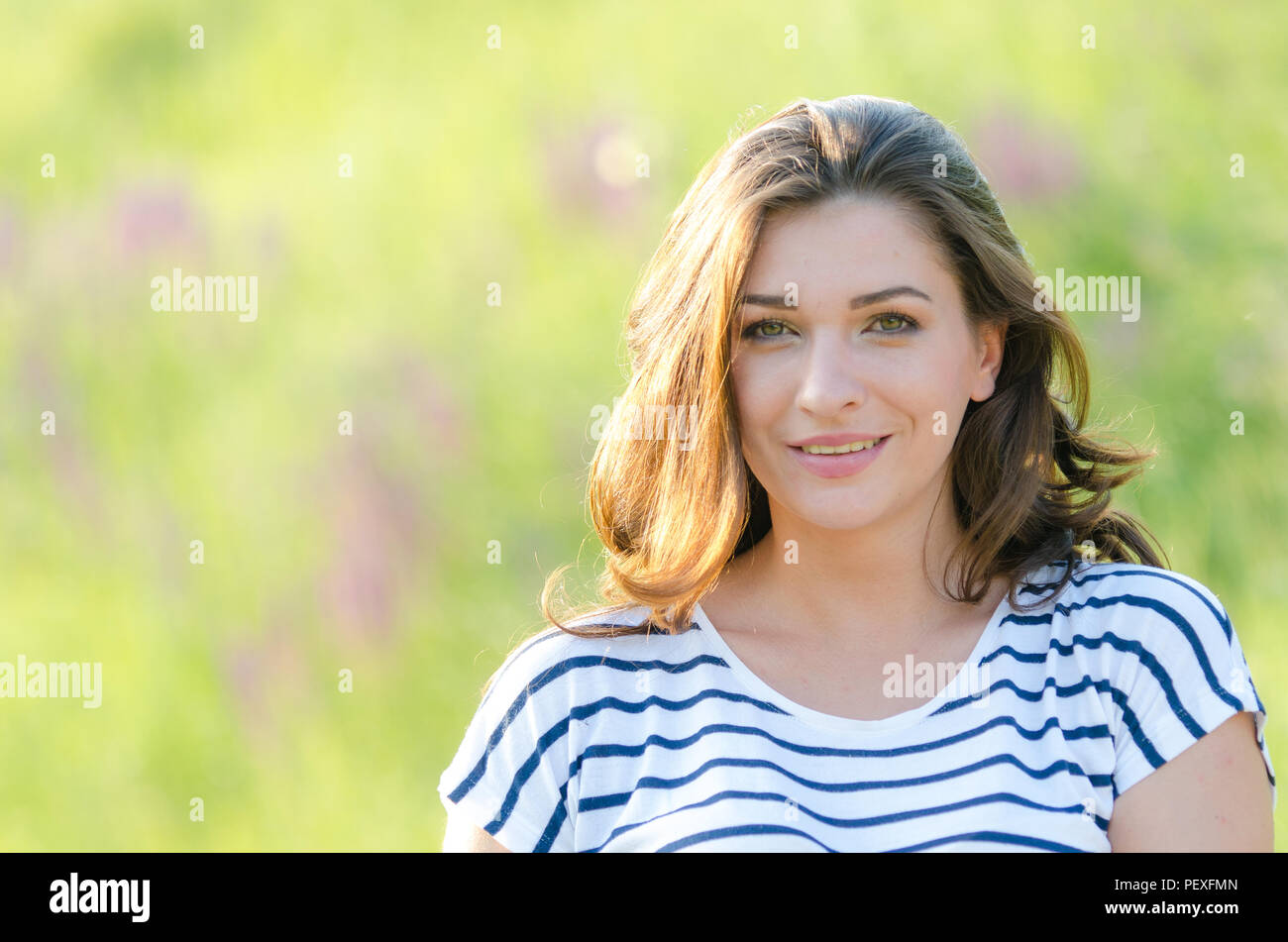 Portrait of a beautiful young girl on nature Stock Photo - Alamy Portrait of a beautiful young girl on nature Stock Photo - Alamy