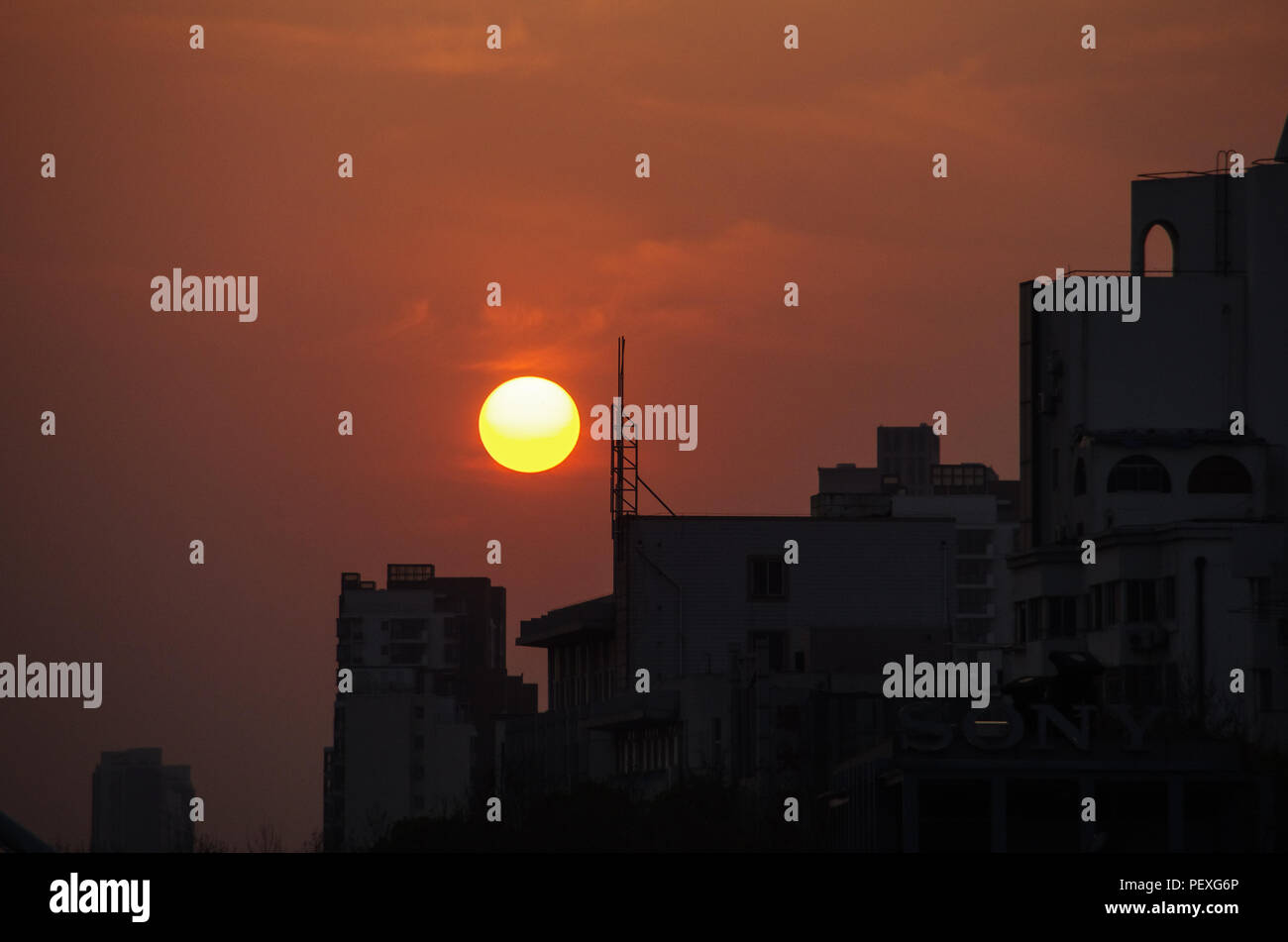 The Sunset over the Chinese Buildings Stock Photo - Alamy