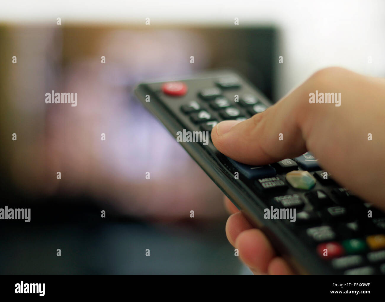 Binge watching TV show - TV set and remote control Stock Photo - Alamy