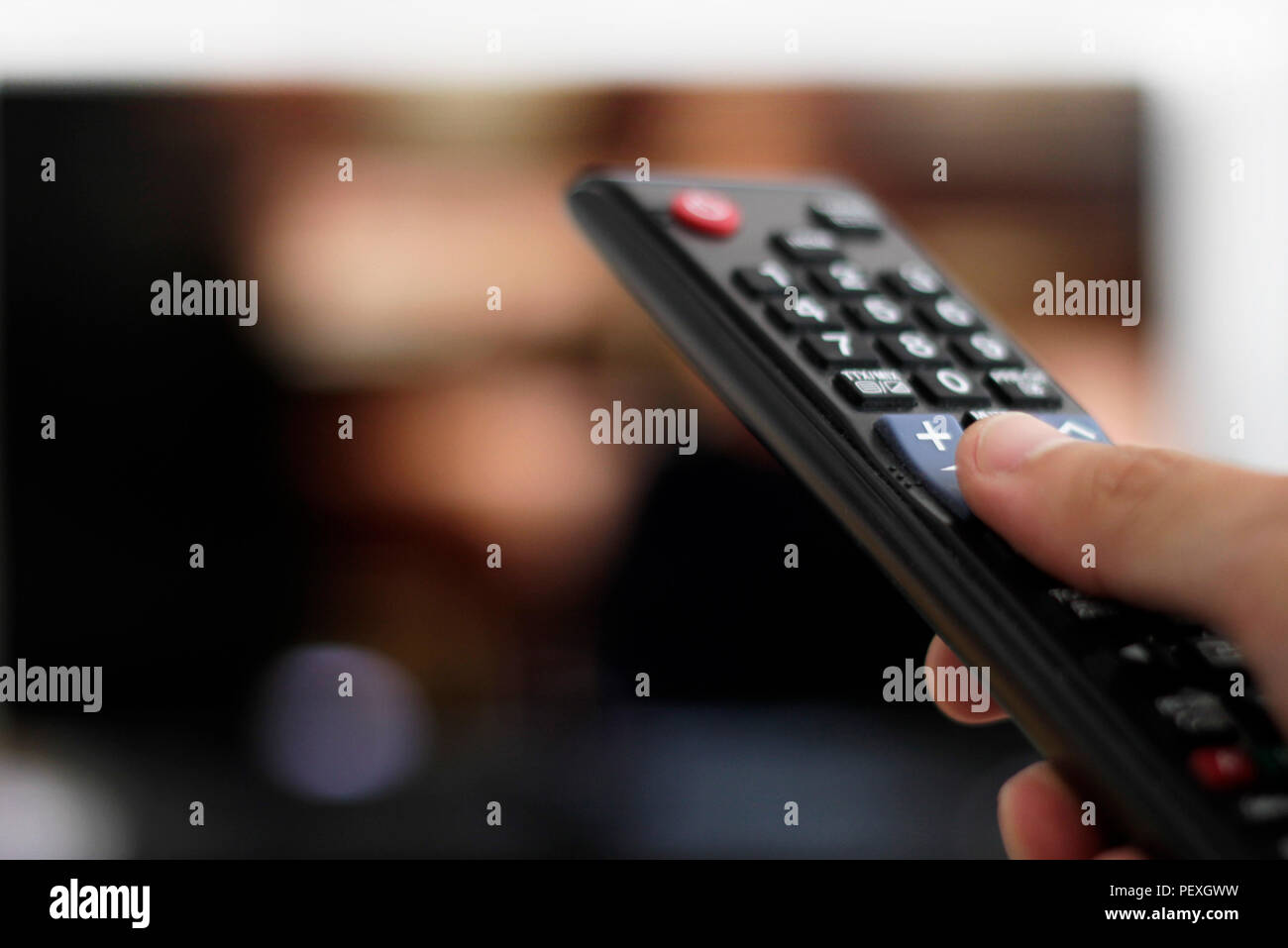 Binge watching TV show - TV set and remote control Stock Photo - Alamy