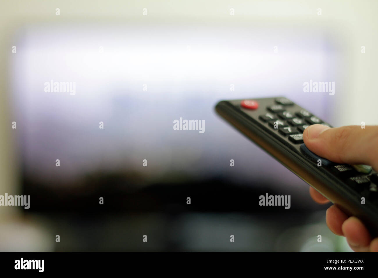 Binge watching TV show - TV set and remote control Stock Photo - Alamy