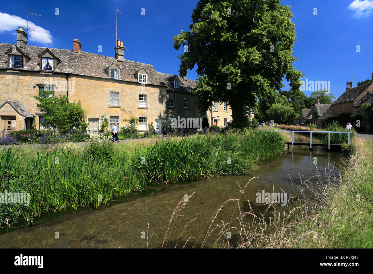 Summer view over Cottages and the River Eye, Lower Slaughter village ...