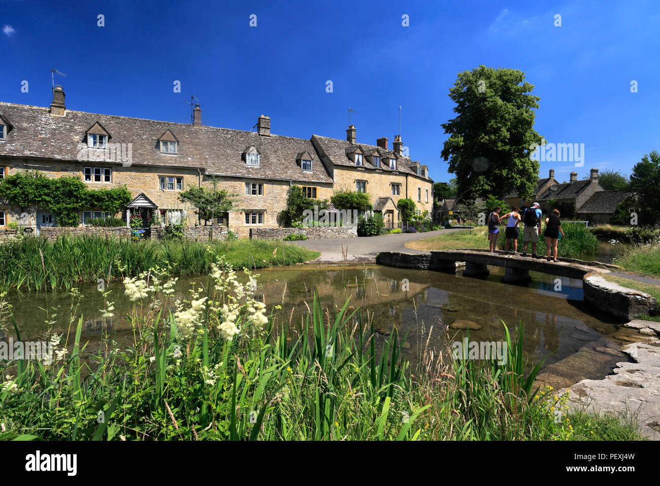 Summer view over Cottages and the River Eye, Lower Slaughter village ...