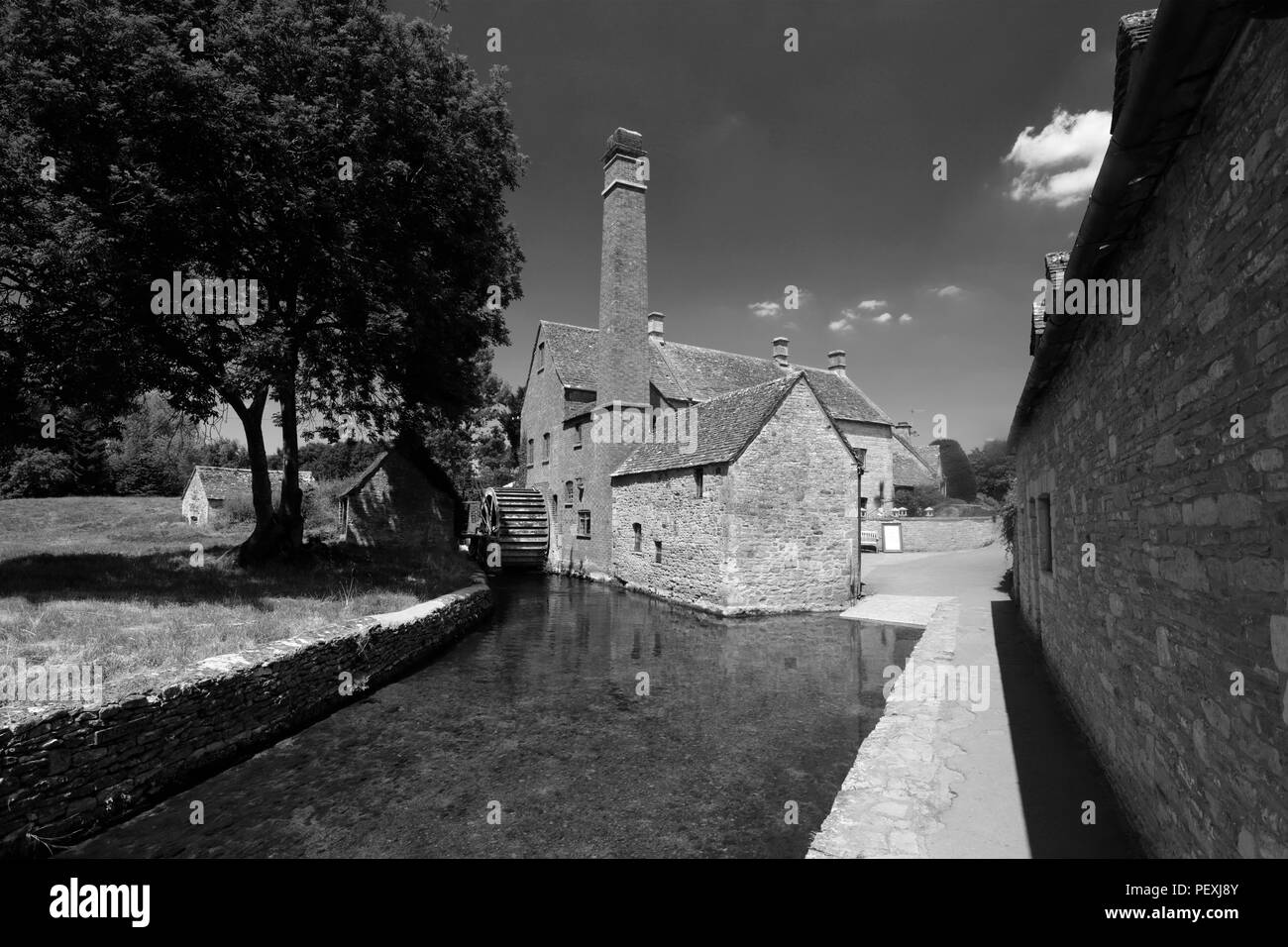 Summer view over Cottages and the River Eye, Lower Slaughter village ...