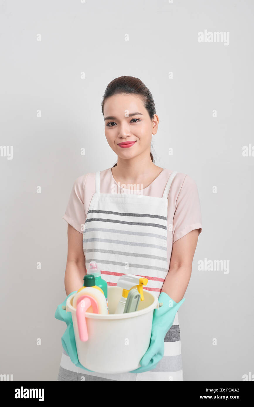 people, housework and housekeeping concept - happy woman holding ...
