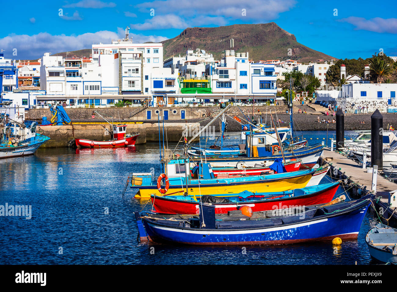 Traditional houses,fishing boats and sea in Puerto de la Nieves village ...