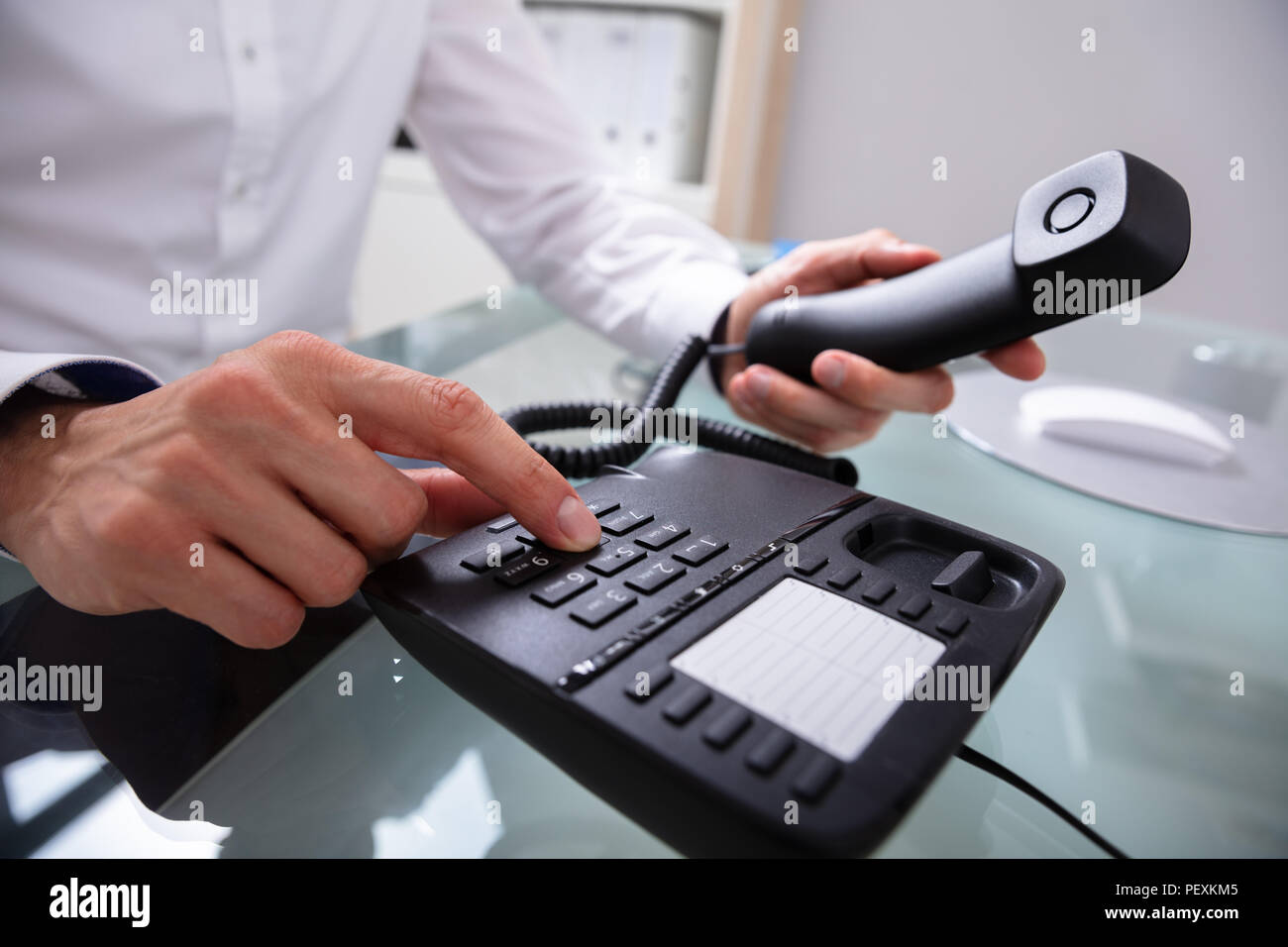 Close-up Of A Businessman's Hand Calling On Landline Stock Photo - Alamy
