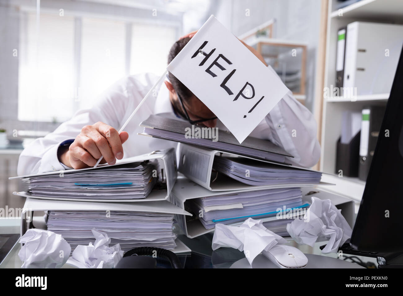 Overworked Businessman Holding Help Flag With Stack Of Folders On Desk ...