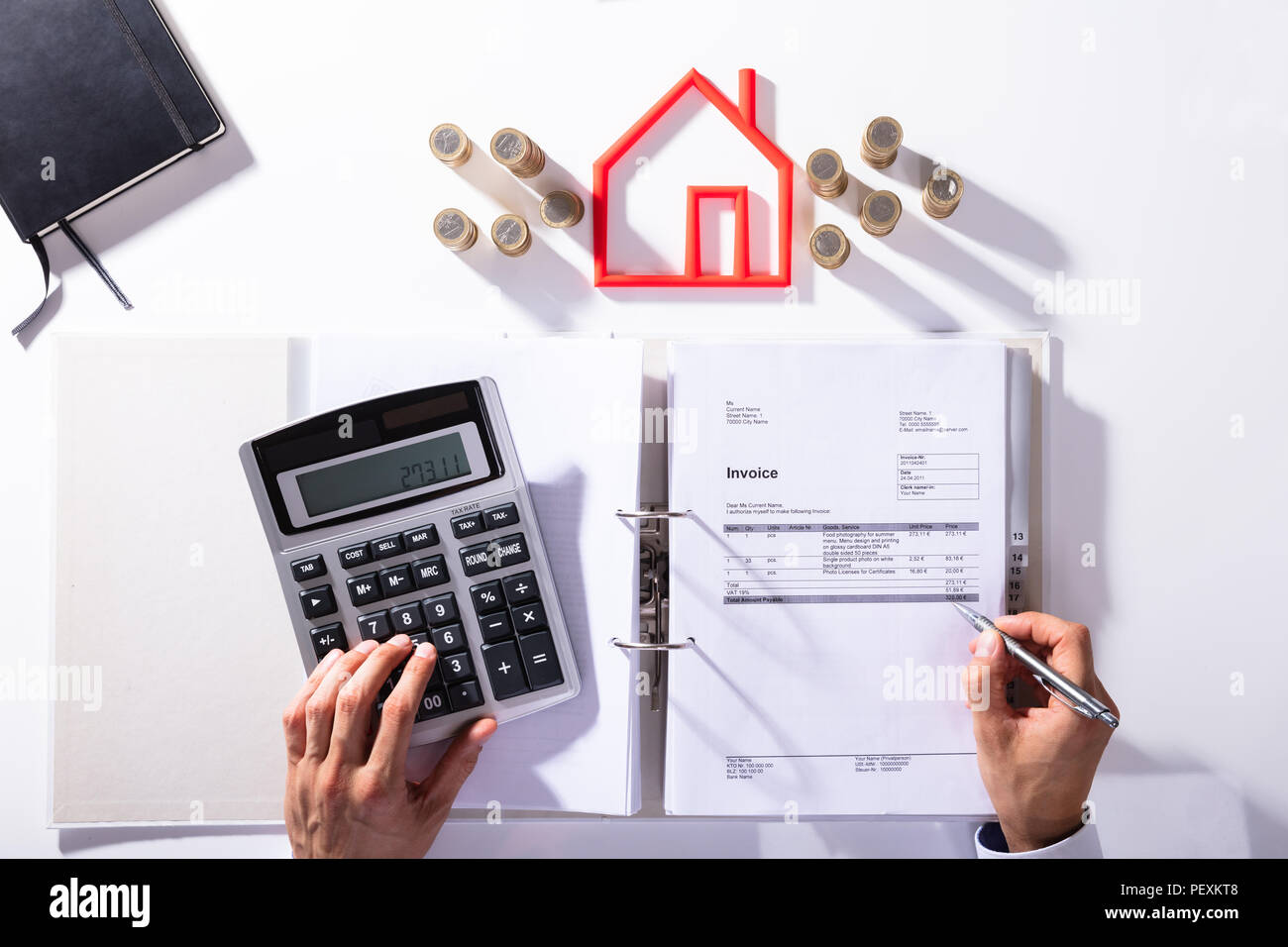 Elevated View Of Businessman Calculating Bill In Front Of Coins And ...