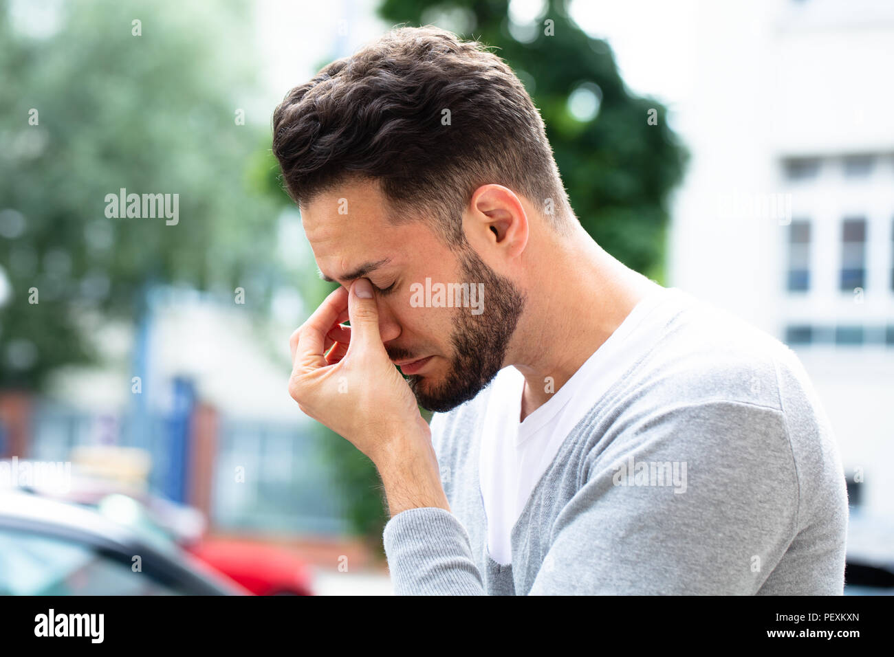 Close-up Of A Young Man Suffering From Headache Stock Photo - Alamy