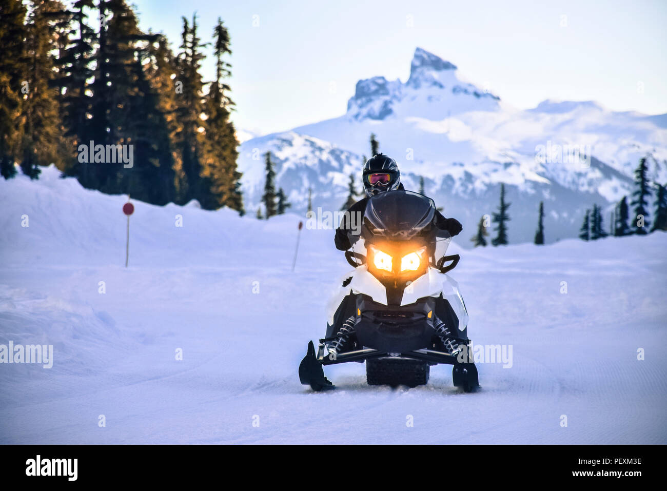 Man riding snowmobile in Callaghan Valley, Whistler, British Columbia ...