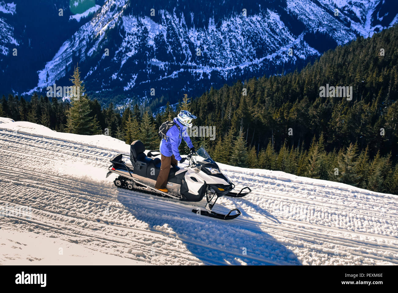 Man riding snowmobile hi-res stock photography and images - Alamy