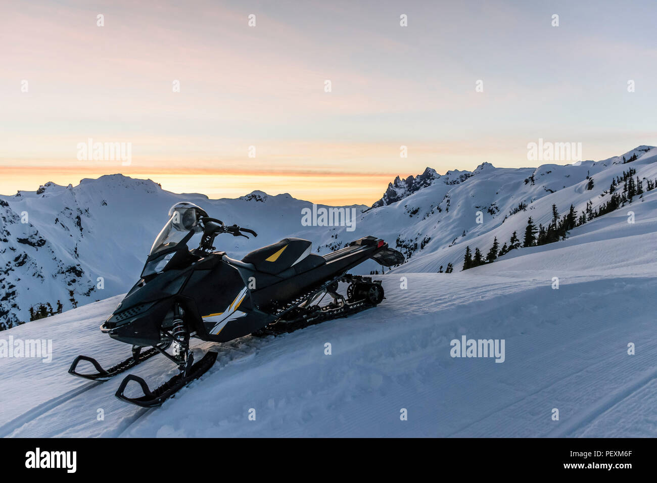 Snowmobile on mountain in winter at sunset, Callaghan Valley, Whistler ...