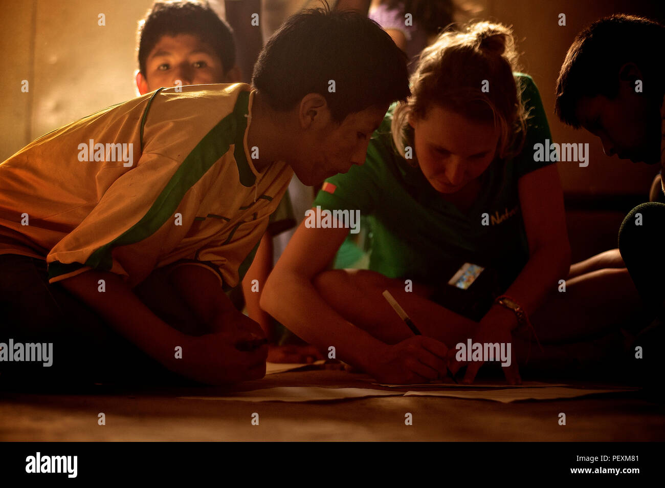PAM Tablada volunteer playing with children, Lima, Lima Province, Peru ...