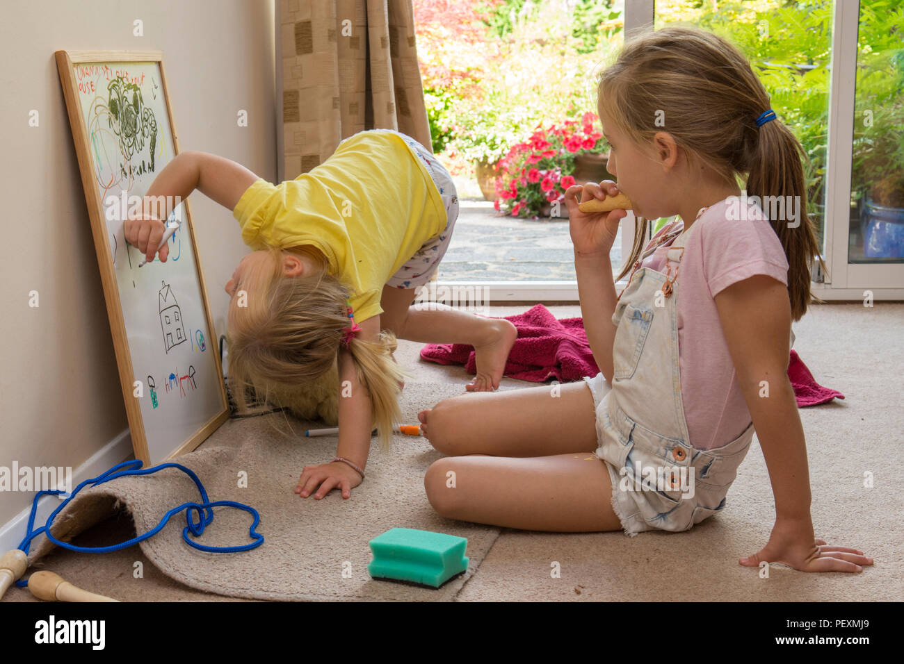 Girls sharing pens hi-res stock photography and images - Alamy