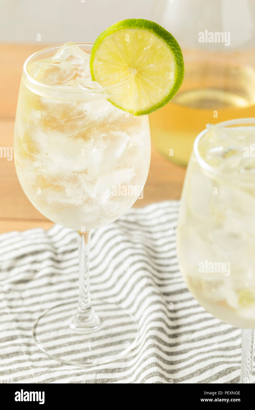 Alcohlic Refreshing Wine Spritzer with LIme and Soda Stock Photo - Alamy