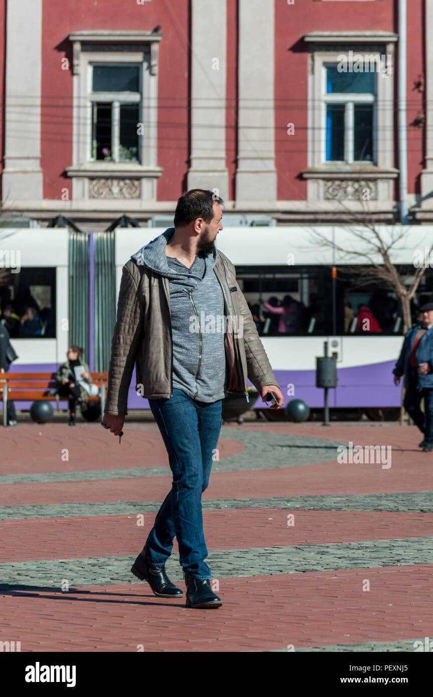 TIMISOARA, ROMANIA - MARCH 15, 2018: Man walking on the street. Real ...