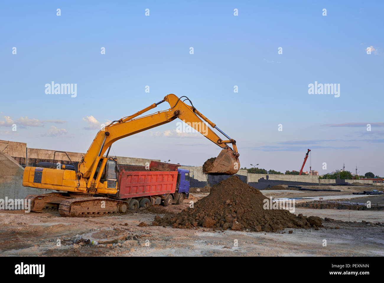 excavator working on a construction site Stock Photo - Alamy