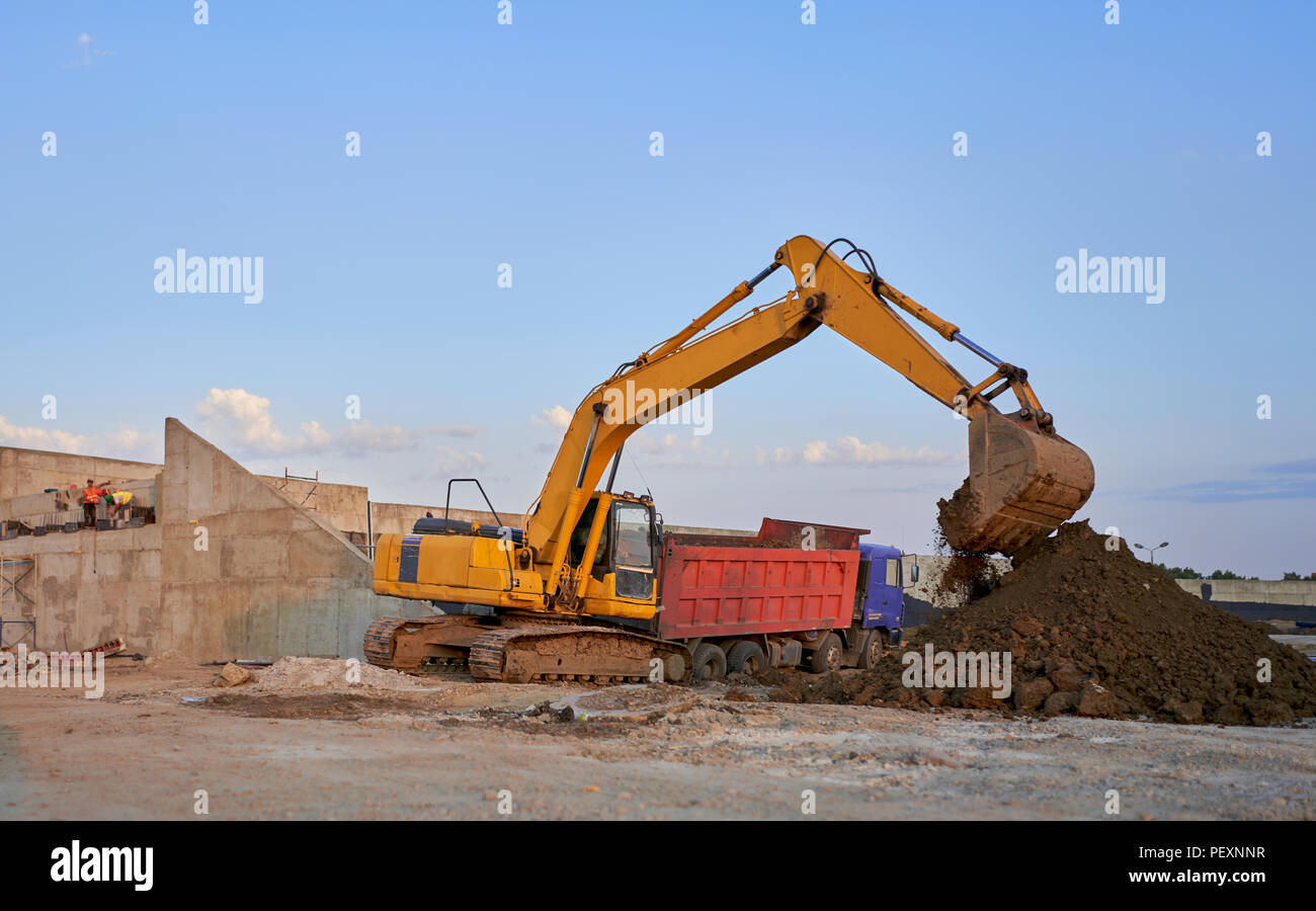 excavator working on a construction site Stock Photo - Alamy