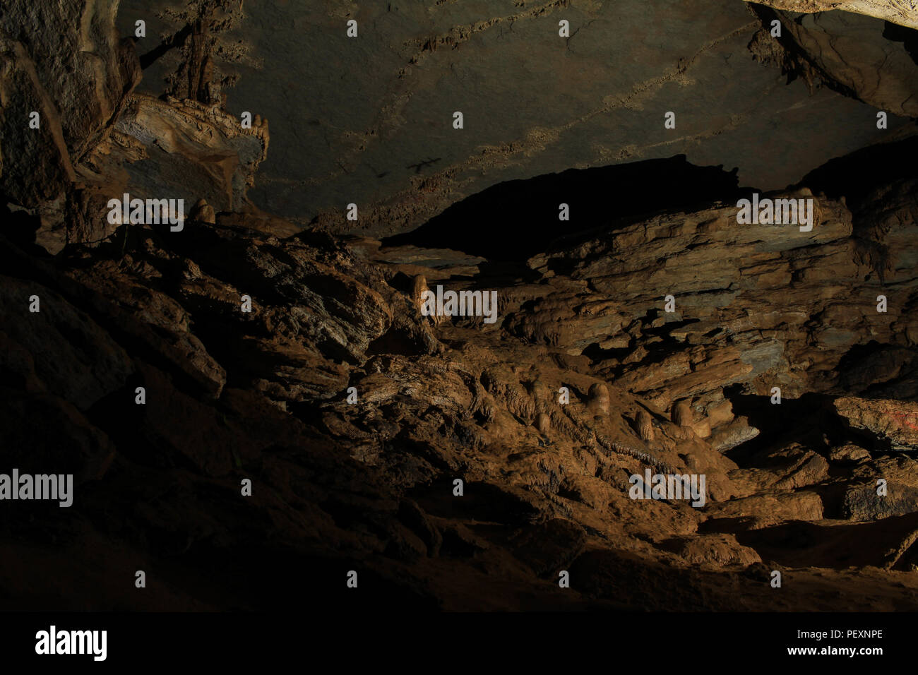 Muddy slope in Tumbling Rock cave Stock Photo - Alamy