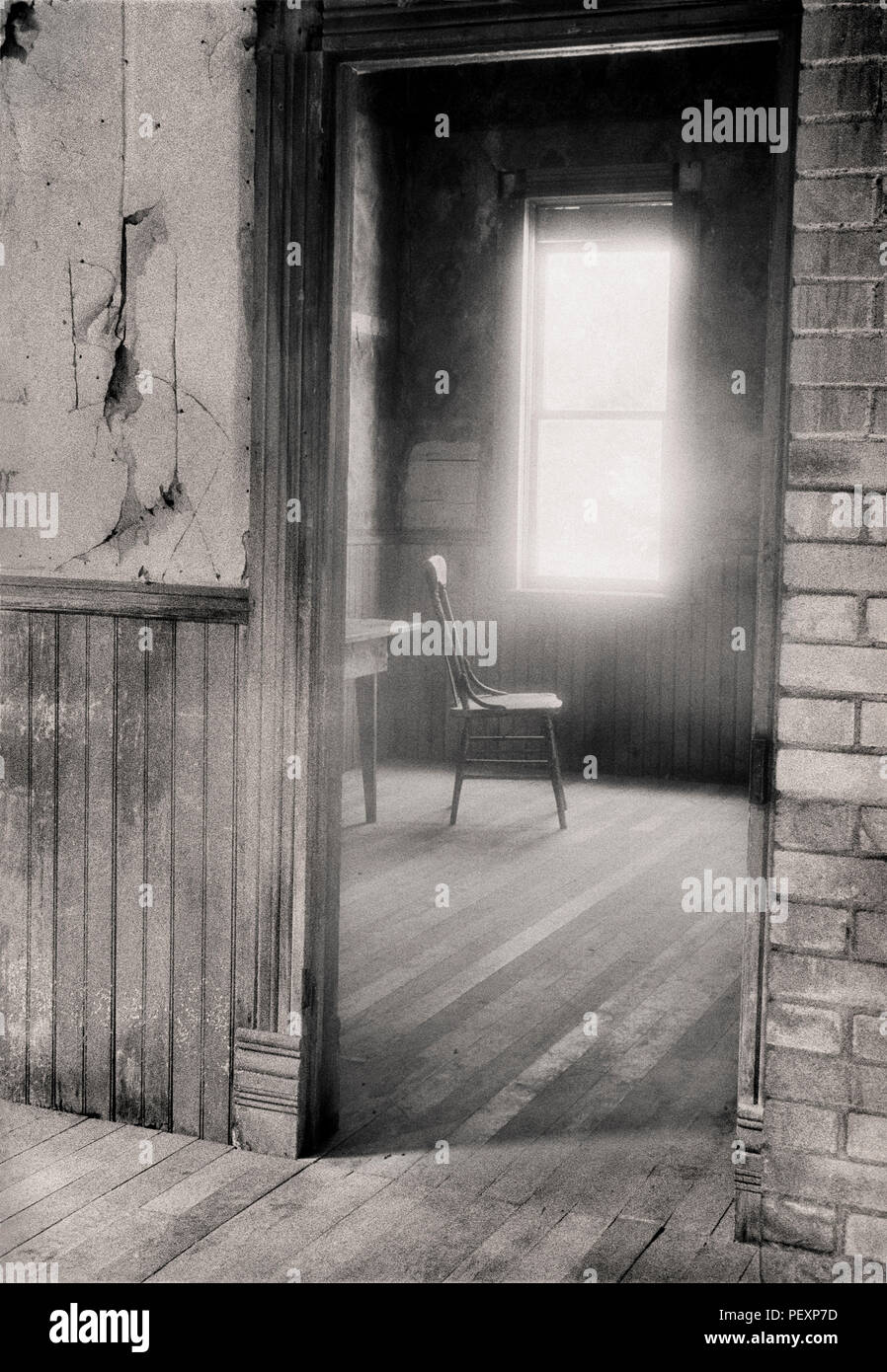 Interior with light from window hitting chair, in the Ghost Town of ...