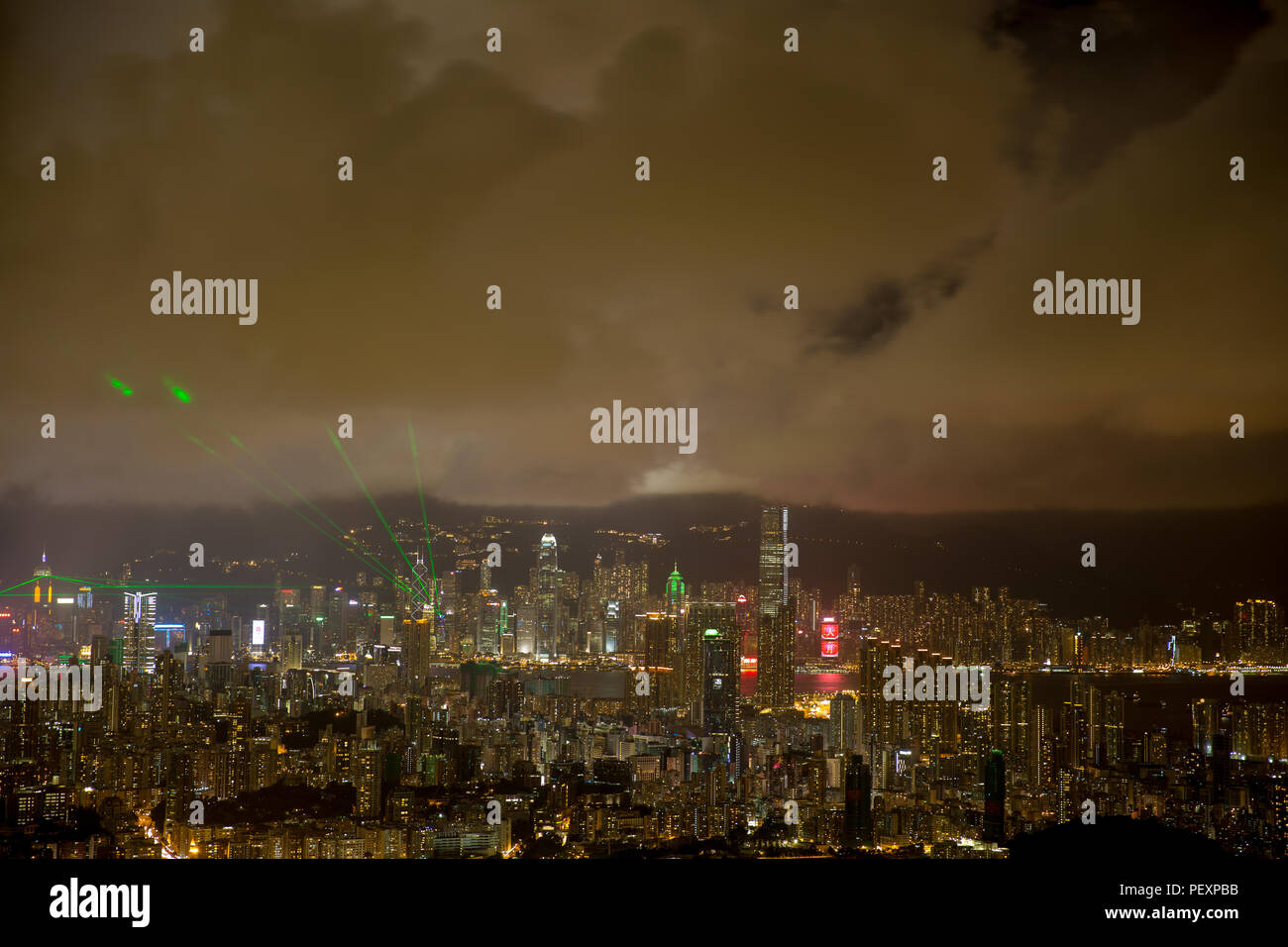 a big asia city by night to the sunrise with all the lights on the ...
