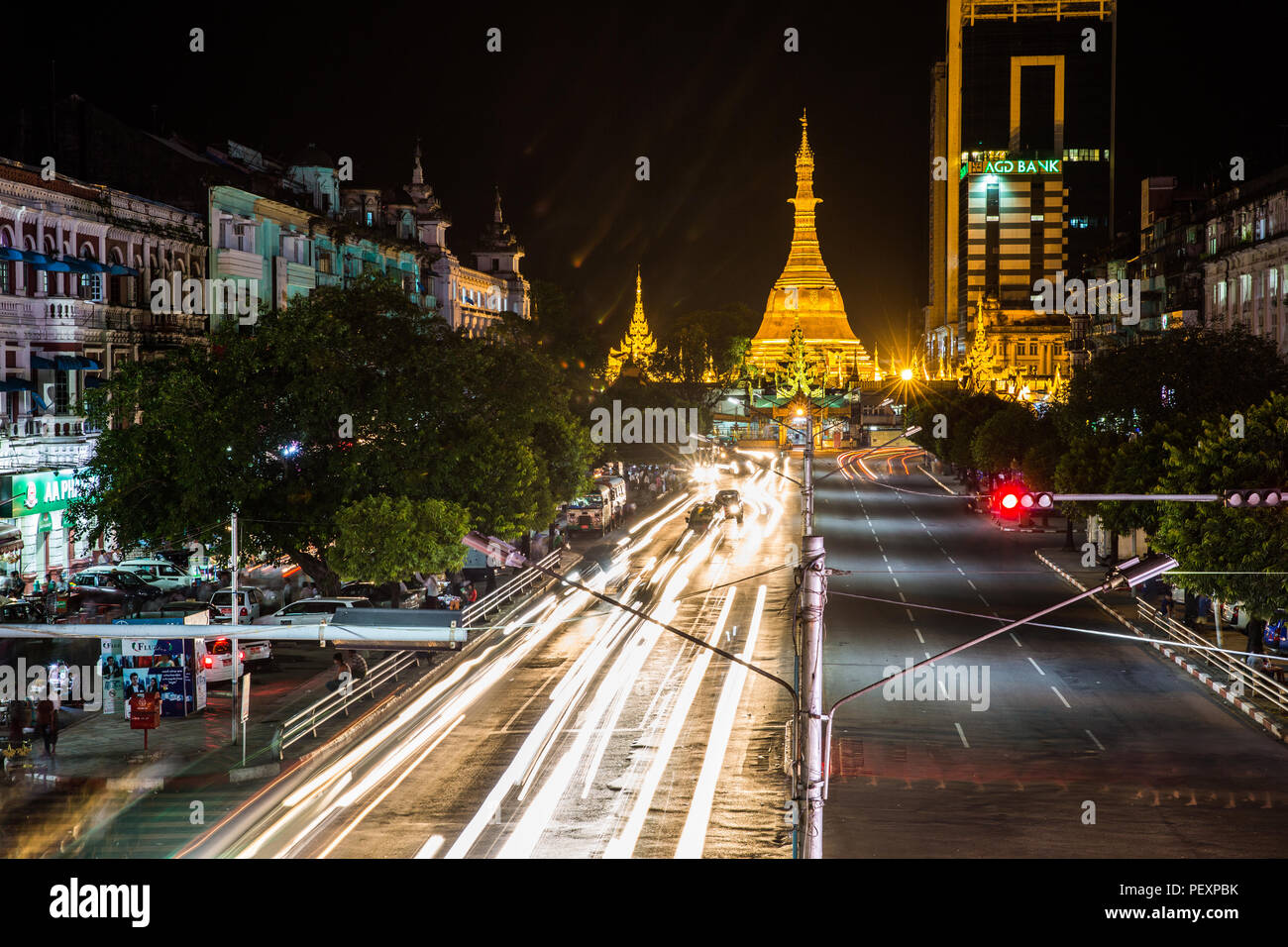 a big asia city by night to the sunrise with all the lights on the ...
